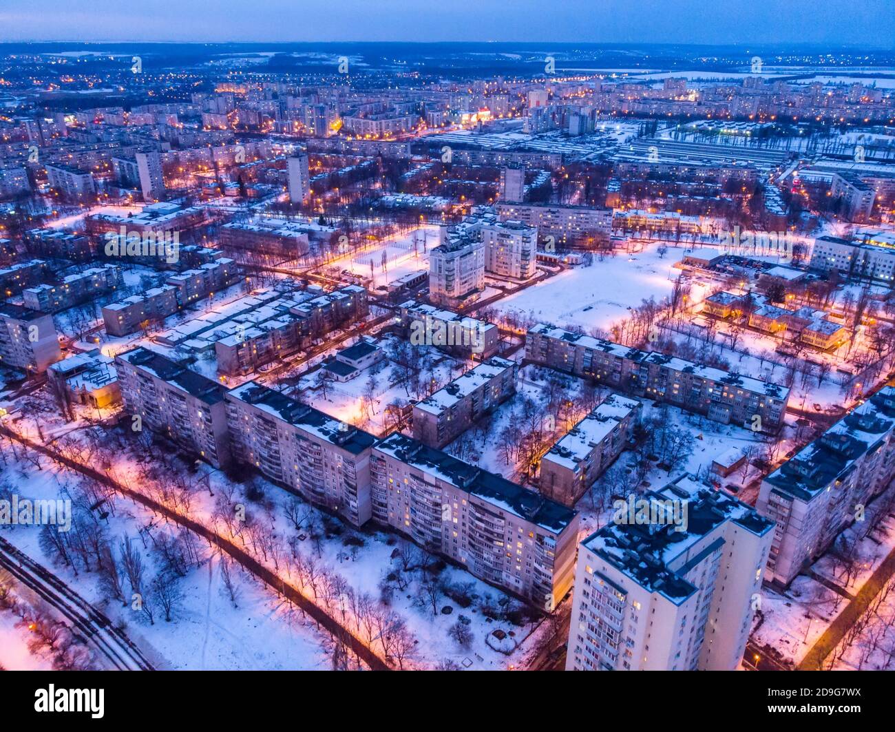 Aerial city winter view with crossroads and roads, houses, buildings ...