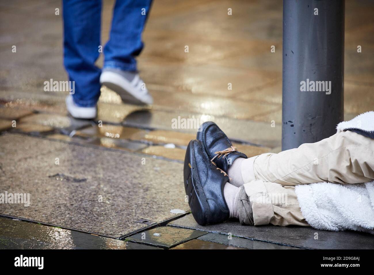 MARKET STREET in Manchester city centre homeless man sleeping on the ...