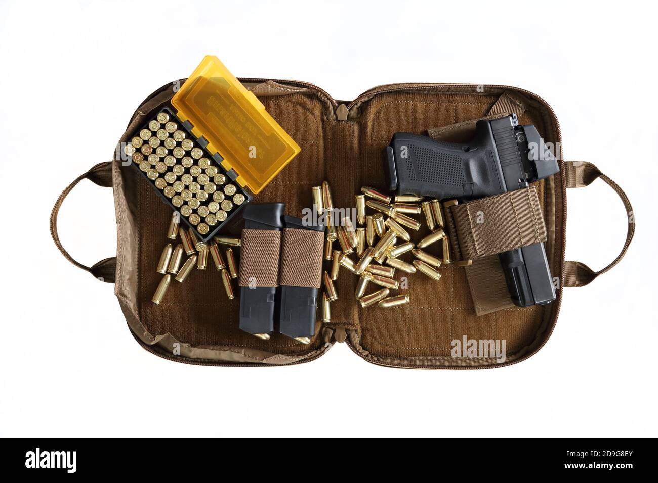 A bag containing a 9 mm pistol with magazines and a box of ammunition ...