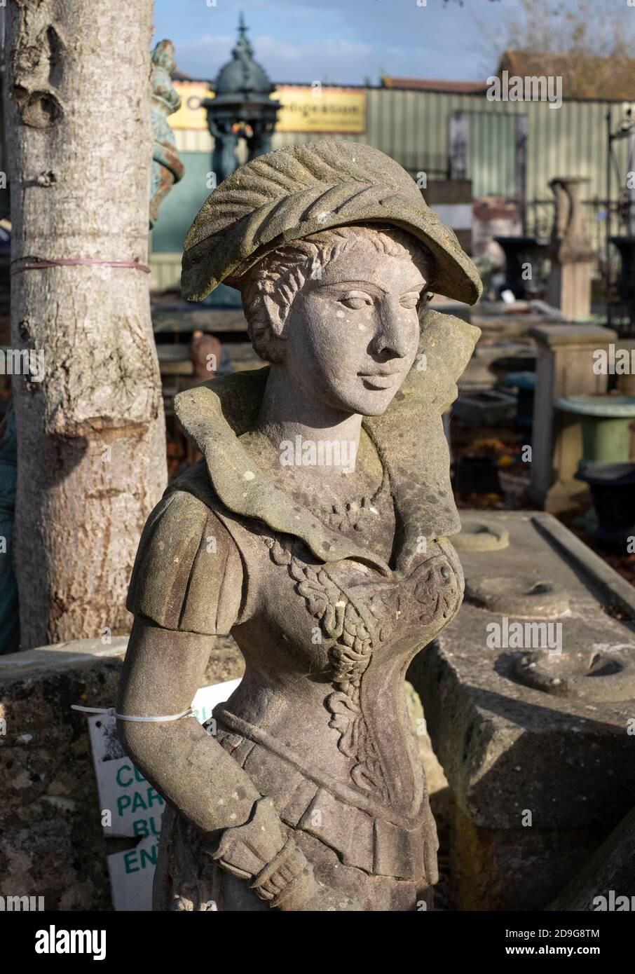 Statue of woman amidst other ephemera at reclamation yard in Wells ...