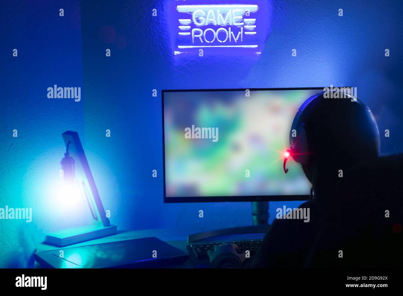 Young gamer playing with the best war game. New technology game trends ...