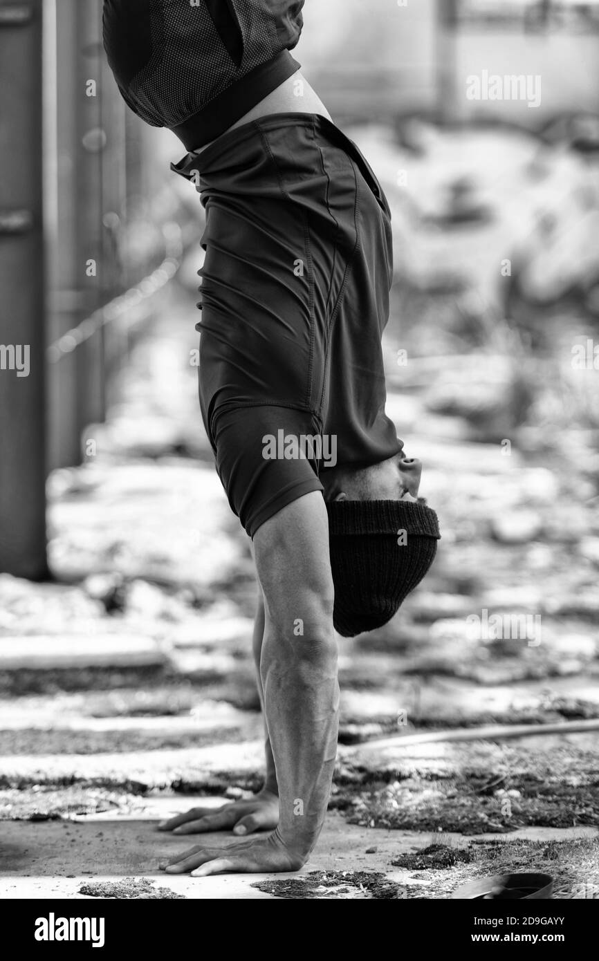 Handsome Man Standing on Hands Strong and Keeping Balance in Warehouse ...