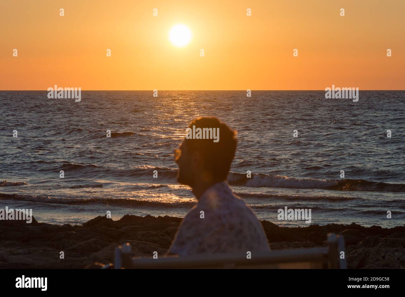 Person staring sunset hi-res stock photography and images - Alamy