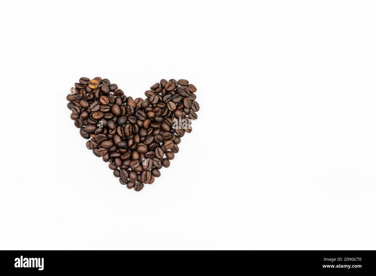 Coffee beans heart shaped isolated on white background Stock Photo - Alamy