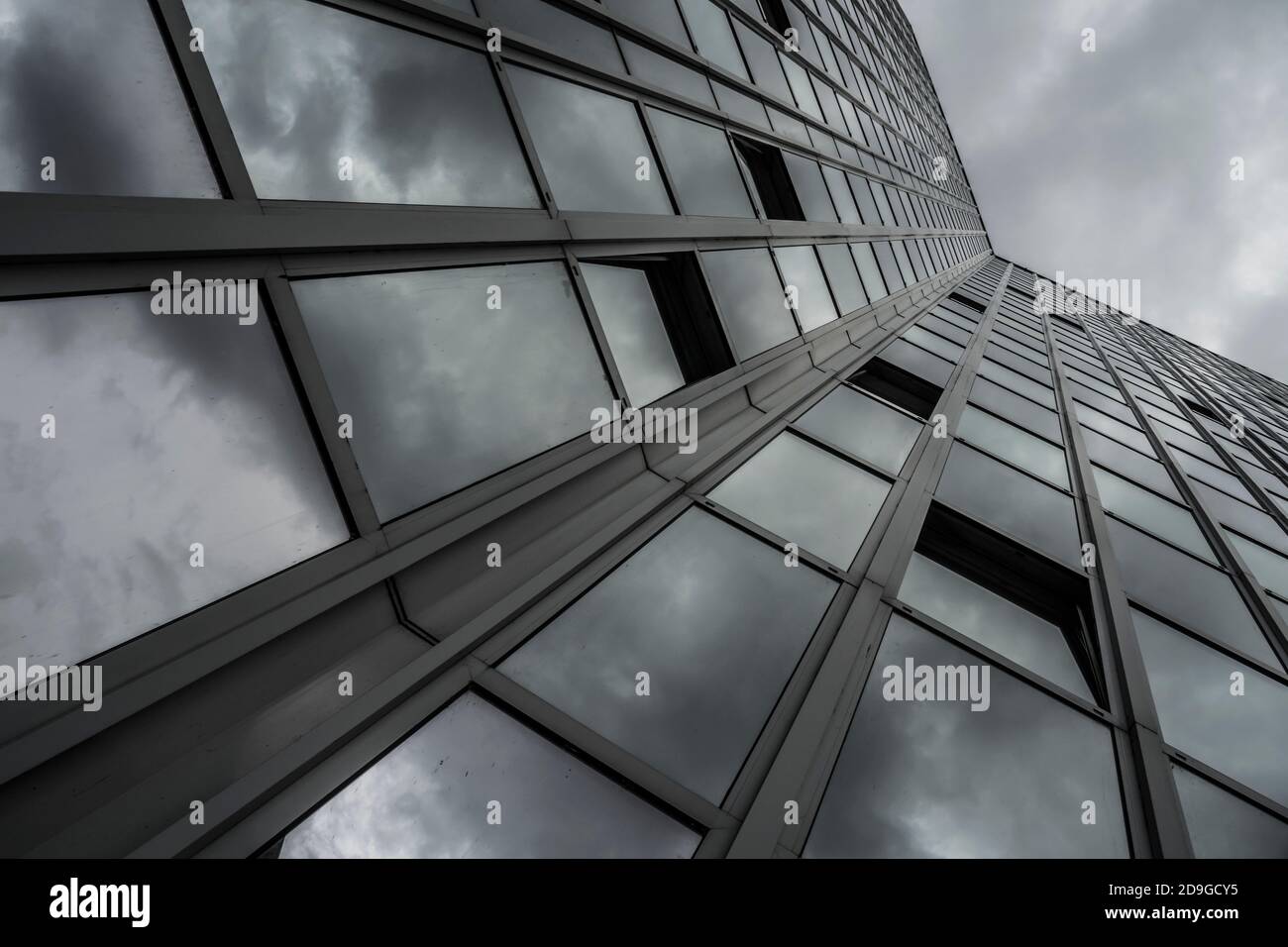 storm clouds in the facade of a modern high rise building Stock Photo ...