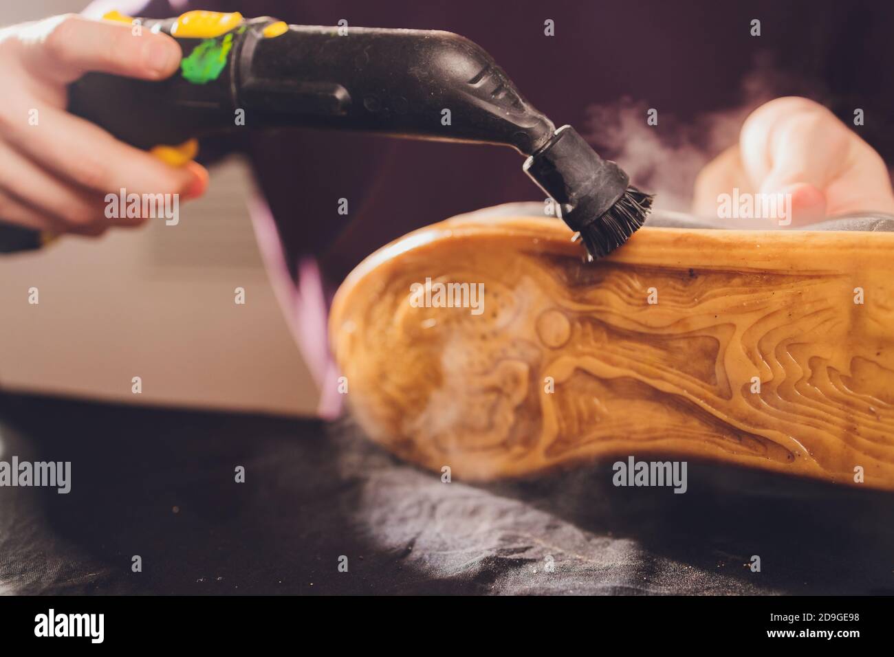 washing the dirty cleaning the shoes with a steam cleaner Stock Photo ...
