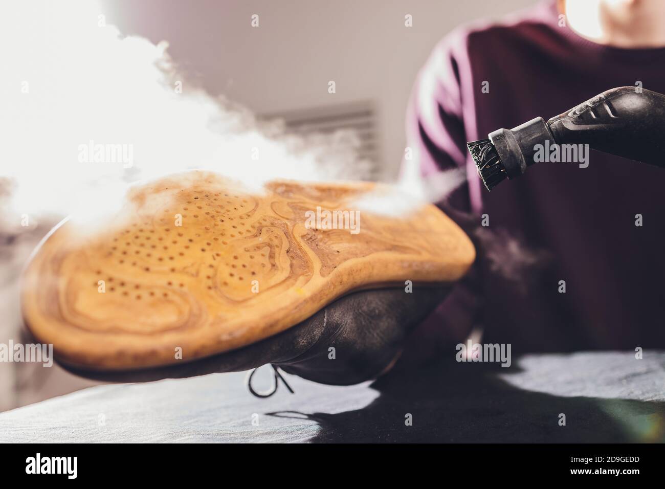washing the dirty cleaning the shoes with a steam cleaner Stock Photo ...