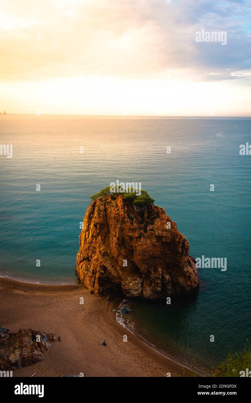Vertical shot of the Cala Illa Roja beach in Spain during sunset Stock ...