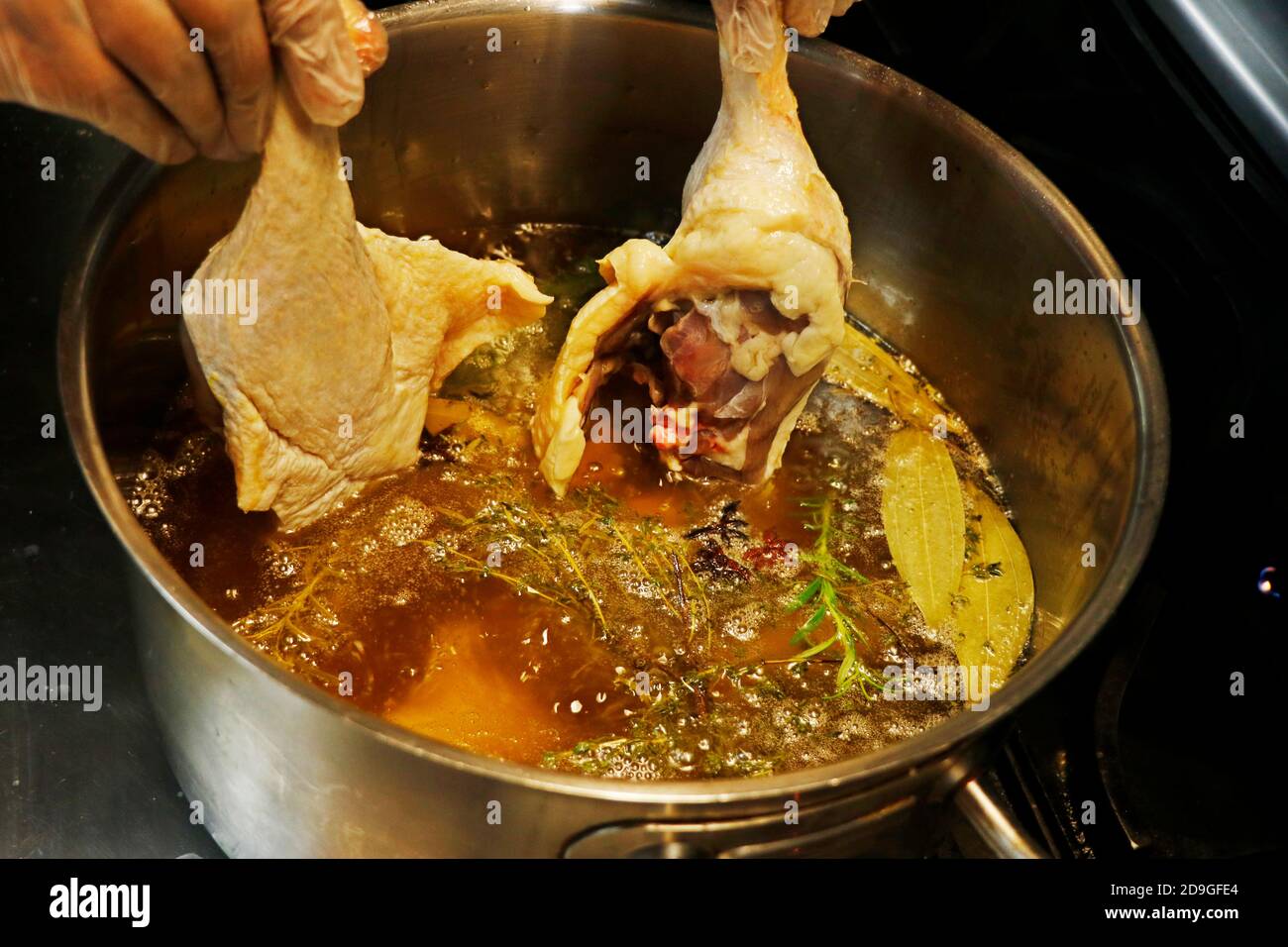 confit duck leg, cooking process of duck confit Stock Photo - Alamy