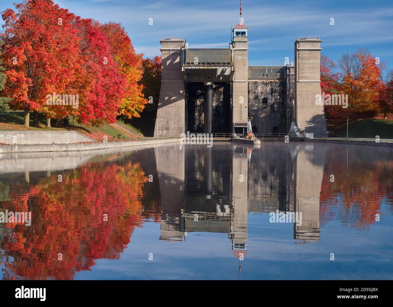 The Peterborough Lift Lock and surrounding colorful autumn trees are ...