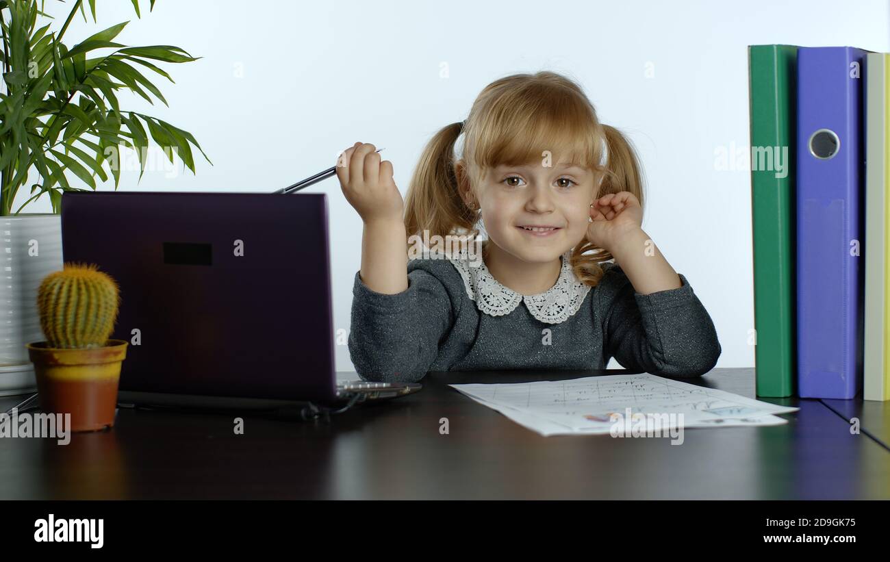 Preschool child girl distance online learning at home. Cute kid ...