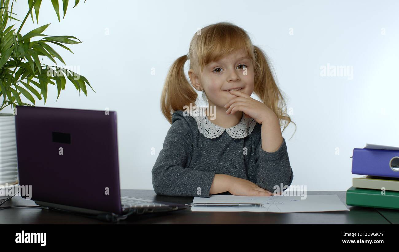 Preschool child girl distance online learning at home. Cute kid ...