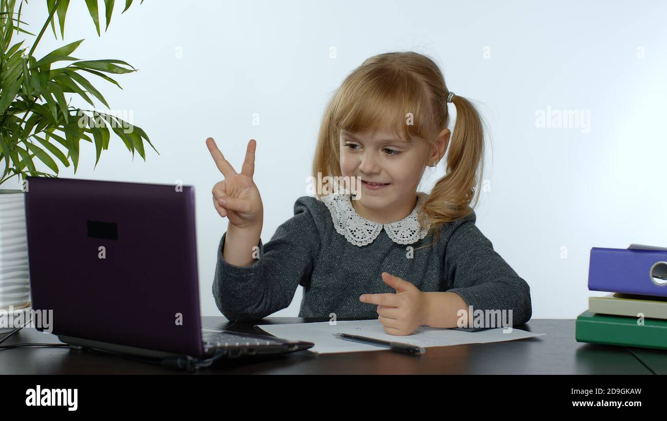 Preschool child girl distance online learning at home. Cute kid ...
