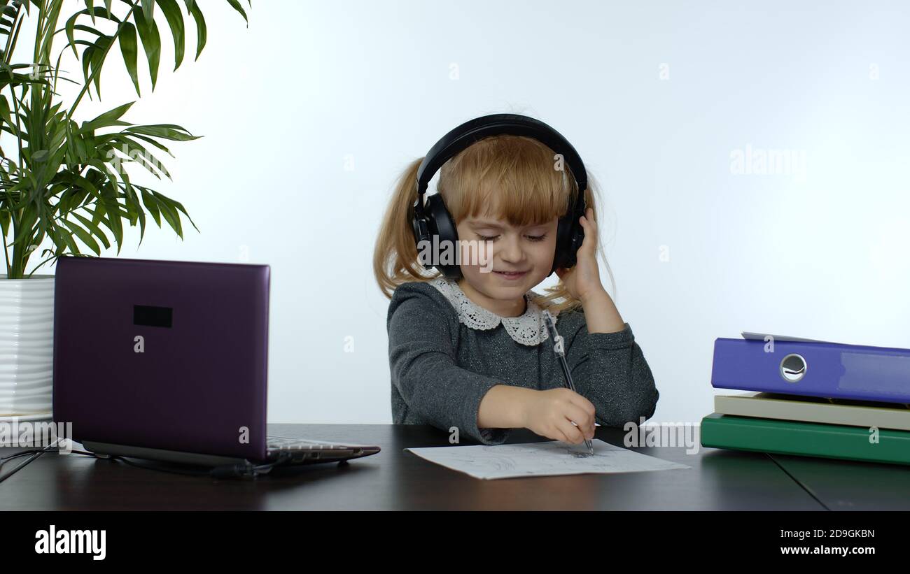 Preschool child girl distance online learning at home. Cute kid ...