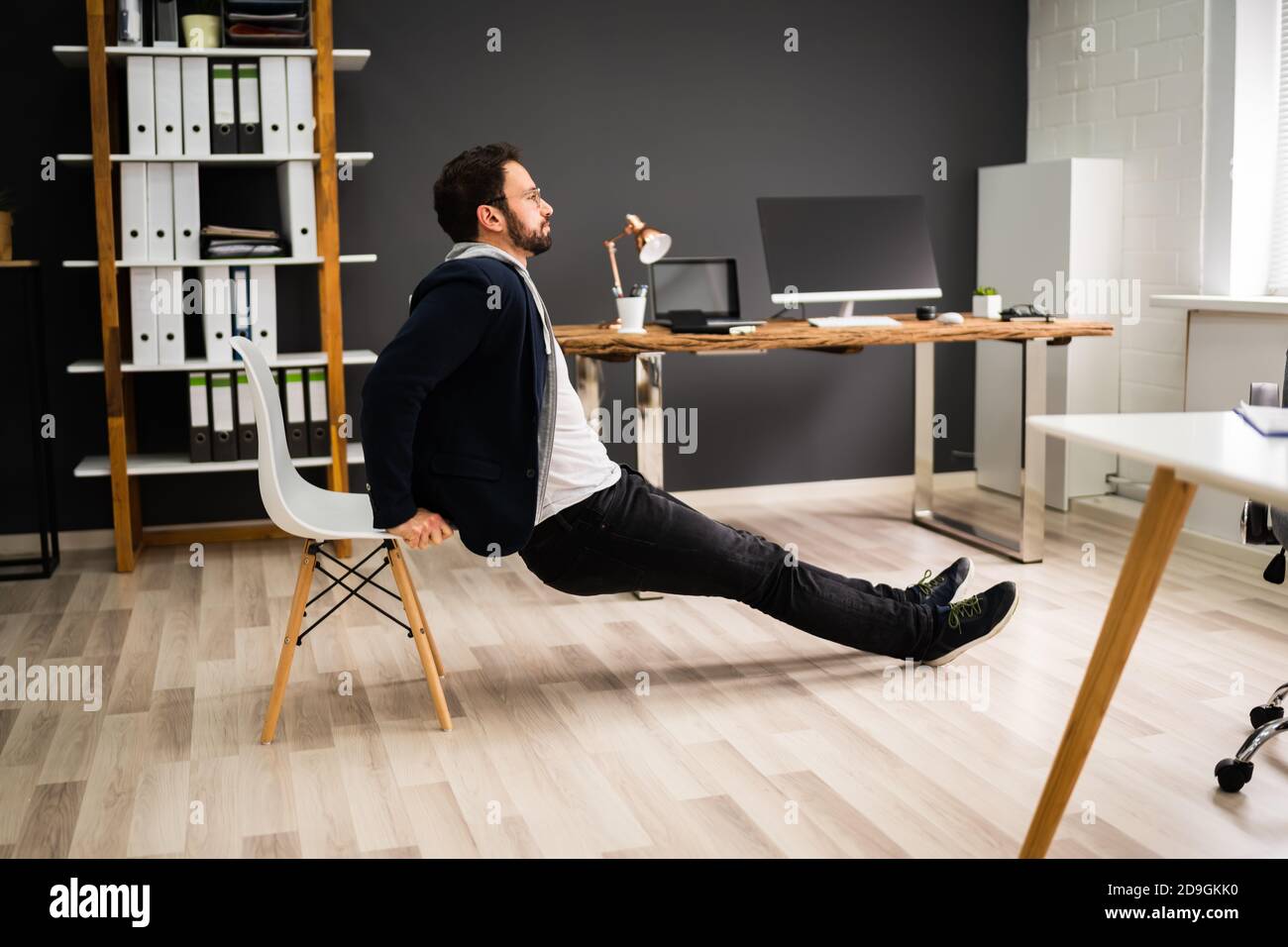 Triceps Dip Chair Workout Exercise At Office Desk Stock Photo - Alamy