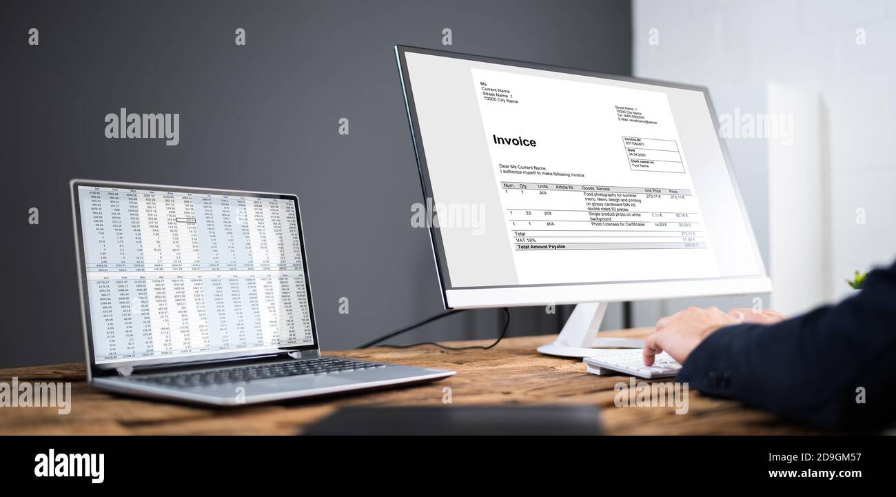 E Invoice Computer Audit On Multiple Screens Banner Stock Photo - Alamy