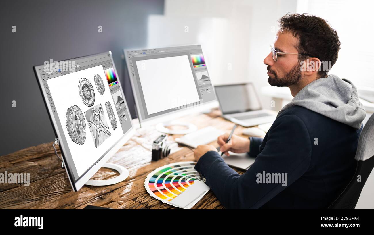 Designer Editing Photos On Multiple Computer Screens Stock Photo - Alamy