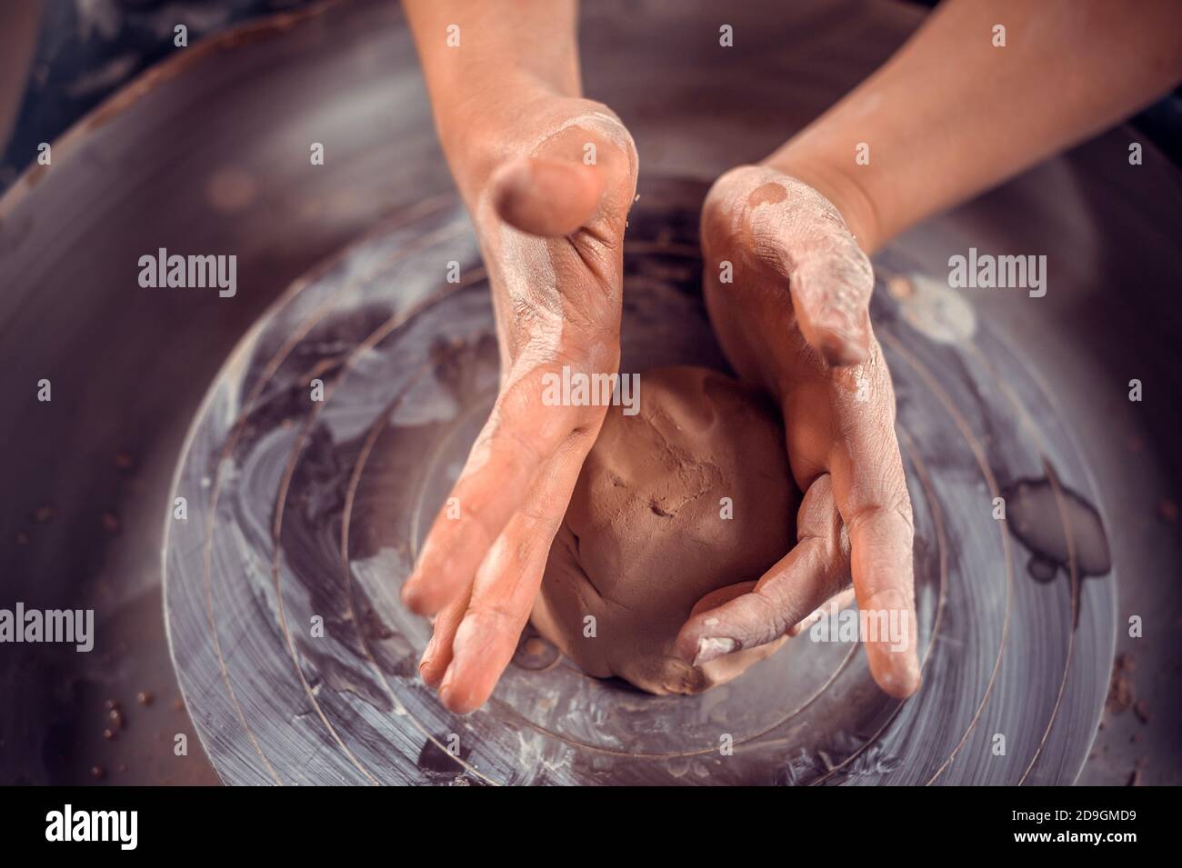 Master class on modeling of clay on a potter's wheel In the pottery ...