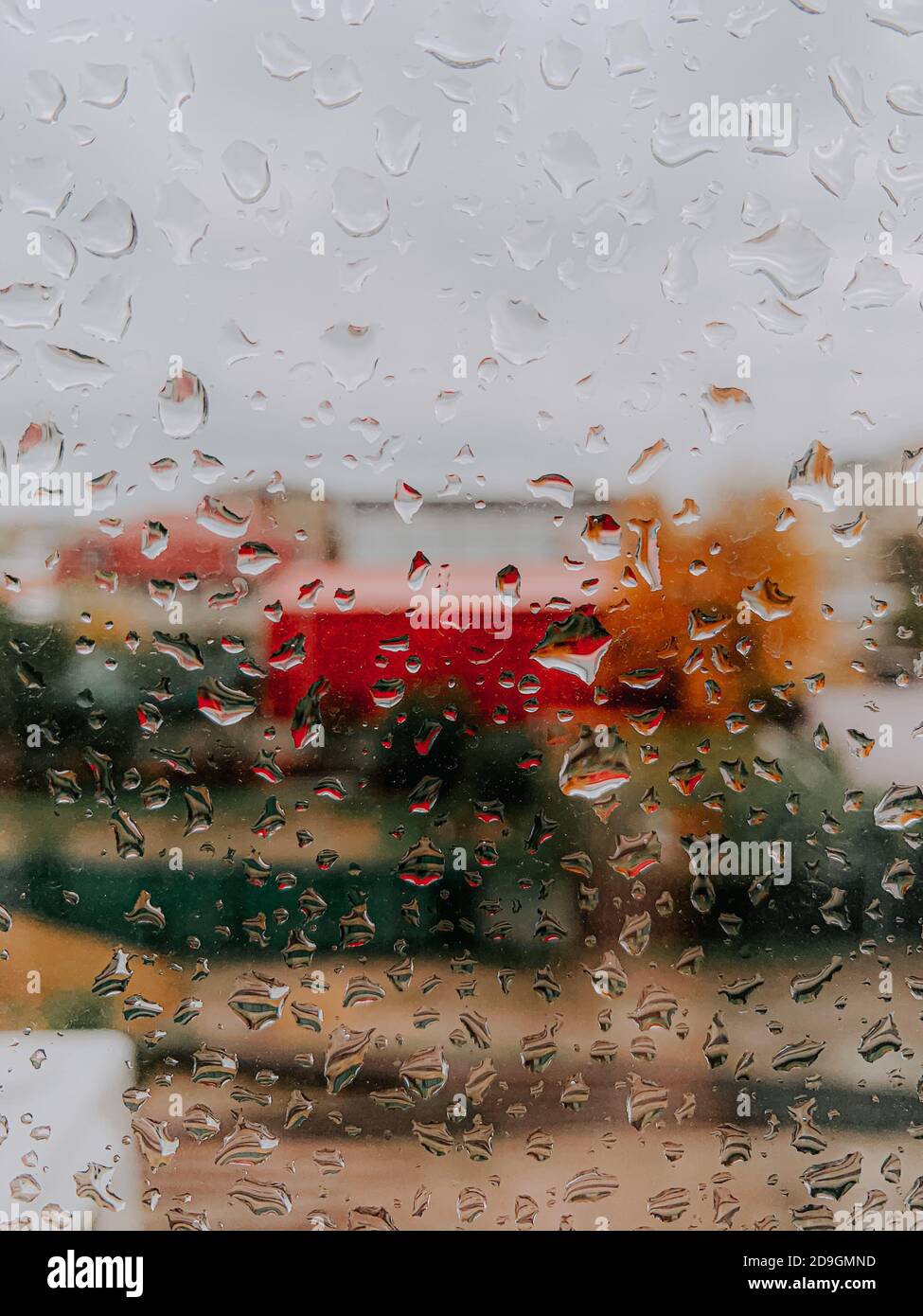 Vertical shot of raindrops on a window Stock Photo - Alamy