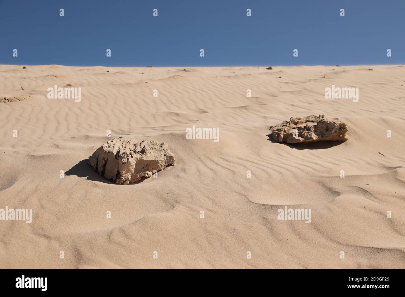 Rock formations in a dry desert Stock Photo - Alamy