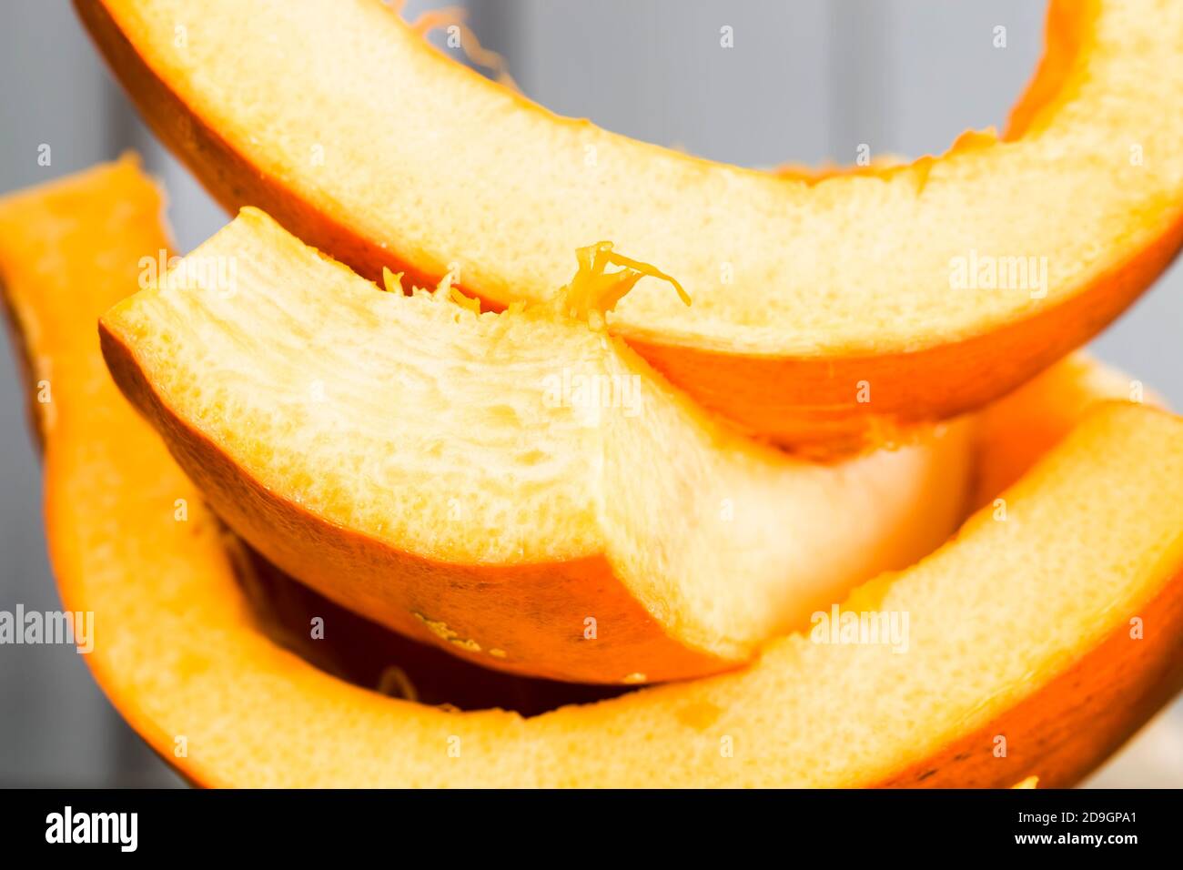 ripe orange pumpkin cut into pieces Stock Photo - Alamy