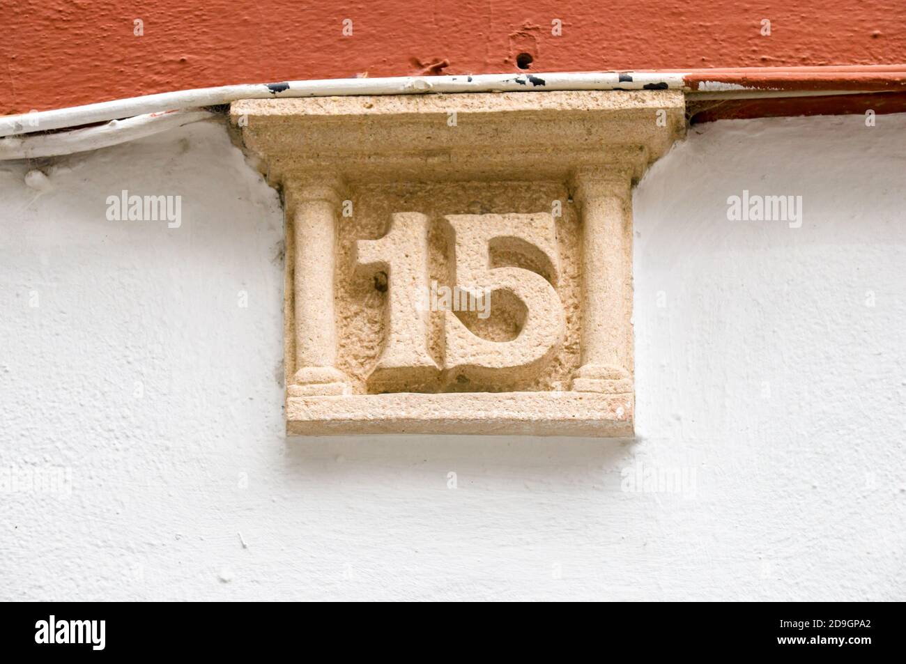 Stone number 15 on a wall Stock Photo - Alamy