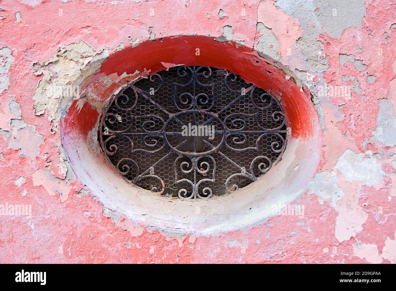 Old round window on a building with rusty red walls Stock Photo - Alamy