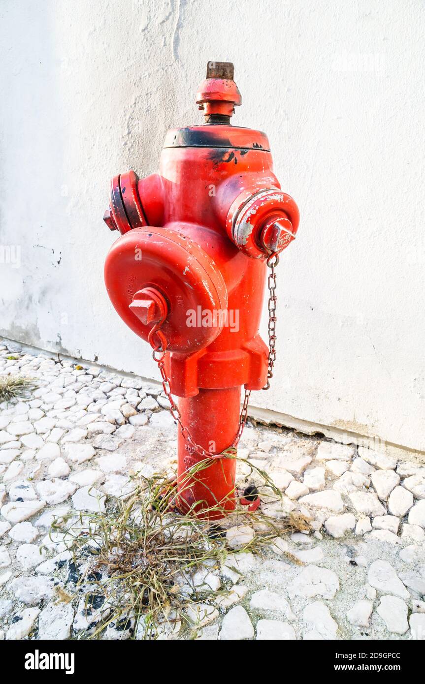 Vertical shot of a red fire hydrant Stock Photo - Alamy