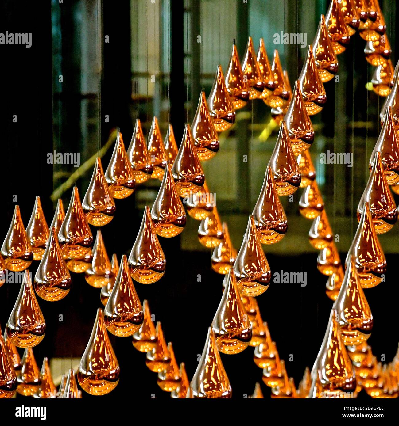 Close up view of suspended bronze droplets which are part of a dynamic ...