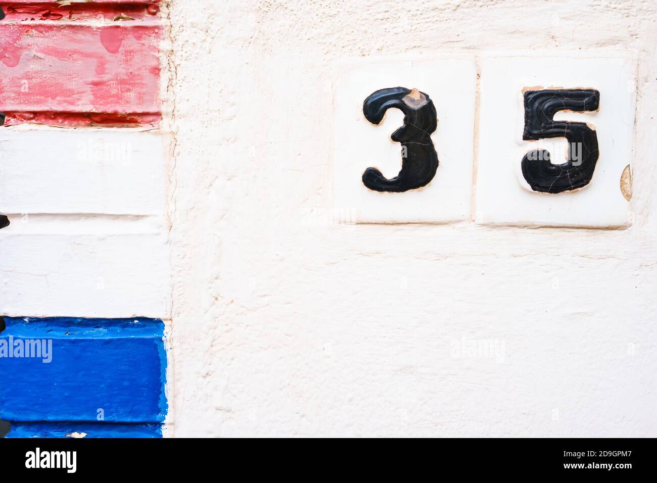 House number 35 on a painted wall Stock Photo - Alamy