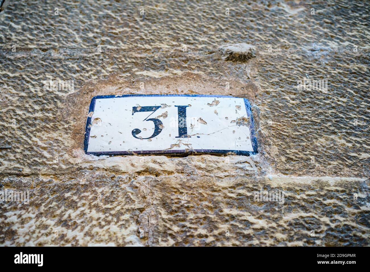 Closeup shot of worn-out metal signboard with house number 31 Stock ...