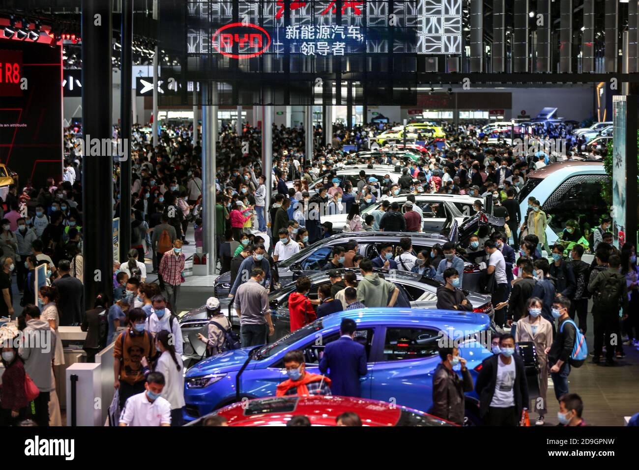 People look at the aotomobiles presented at the 2020 Beijing ...