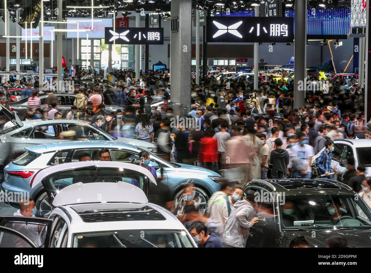 People look at the aotomobiles presented at the 2020 Beijing ...