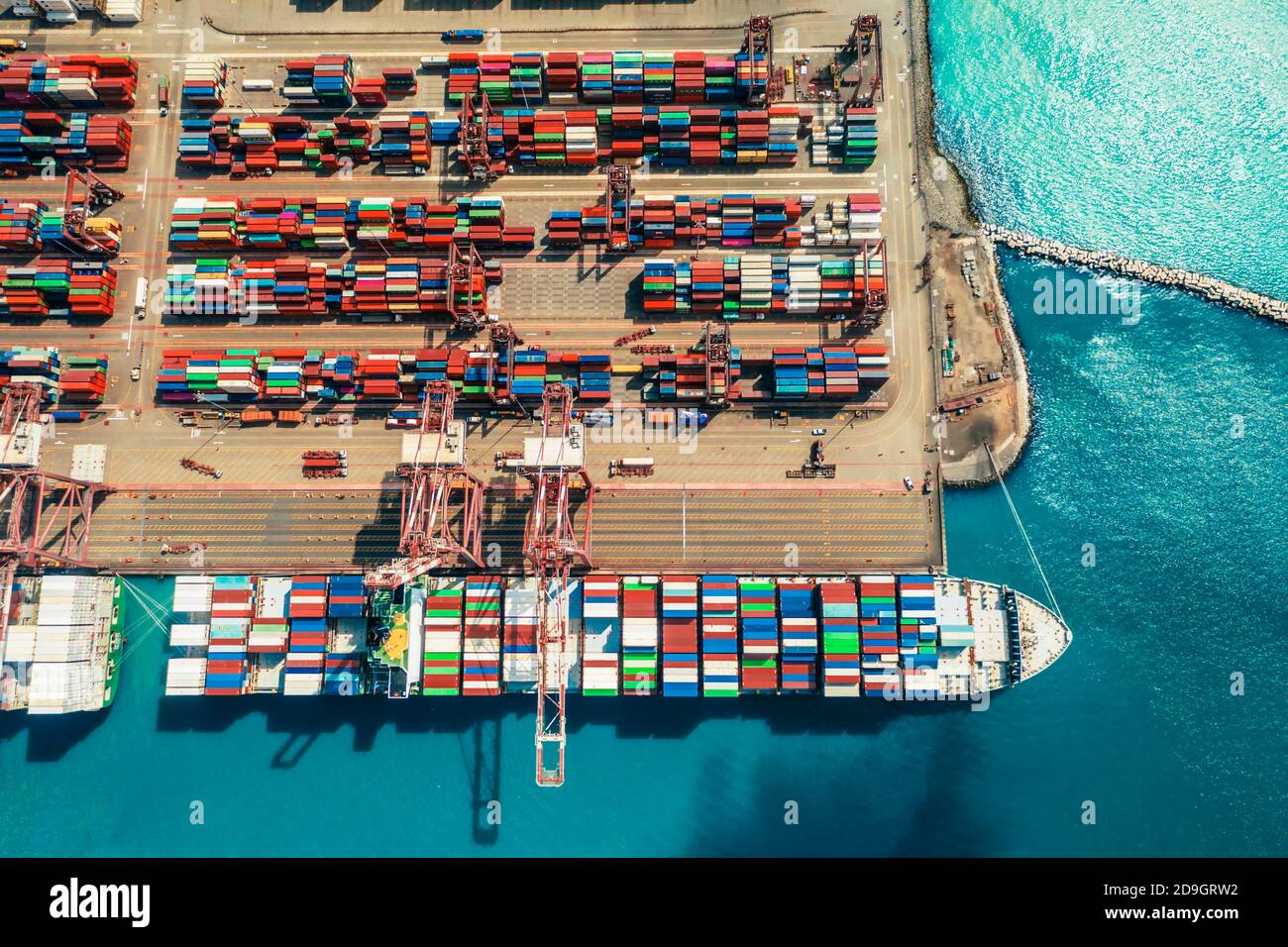 Aerial view container ship carrying container in import export business logistic and ...