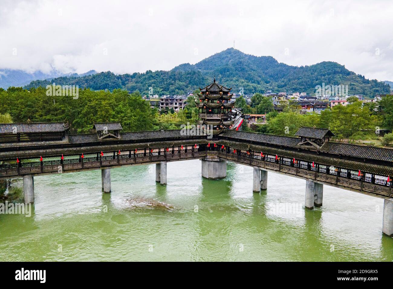 --FILE--The Laoche Reba Tujia Wind and Rain Bridge attracts people to ...