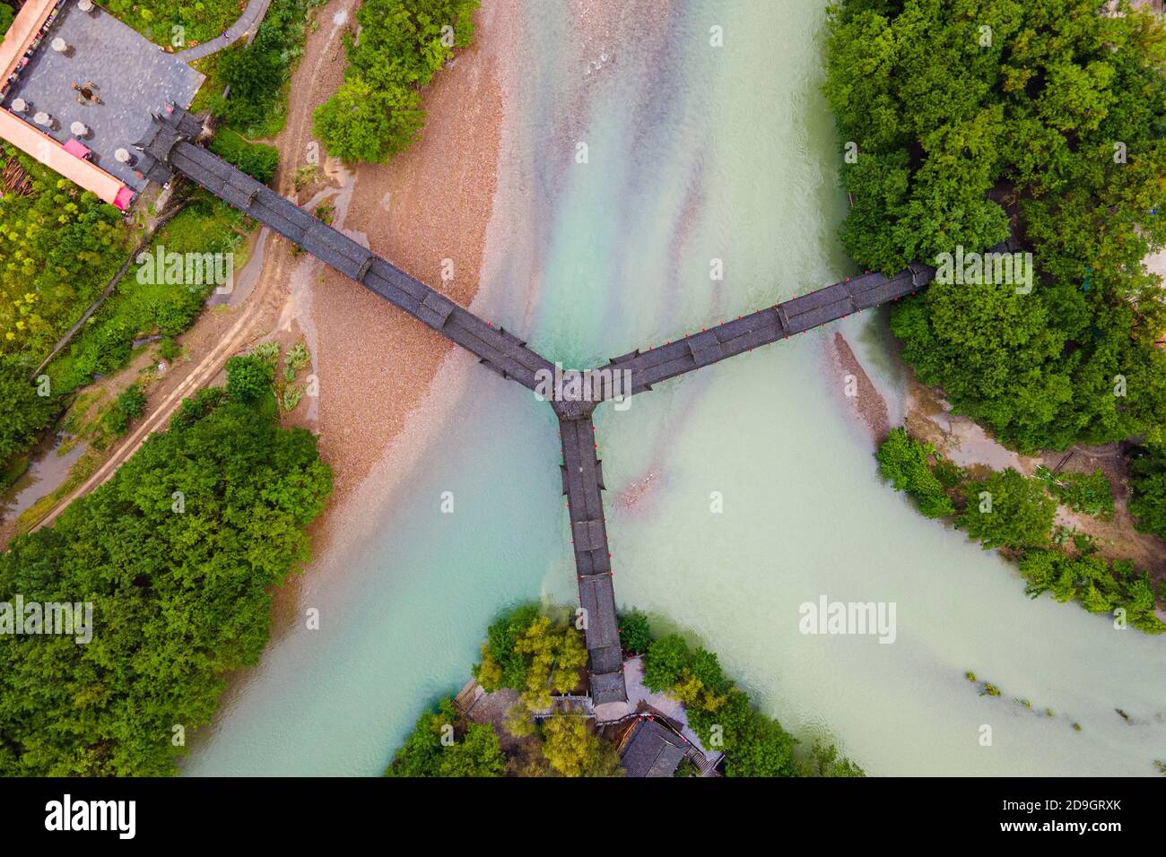 --FILE--The Laoche Reba Tujia Wind and Rain Bridge attracts people to ...