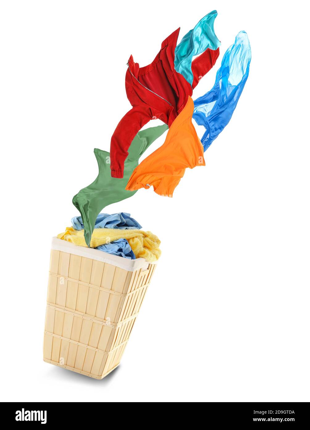 Laundry basket with flying clothes on white background Stock Photo - Alamy