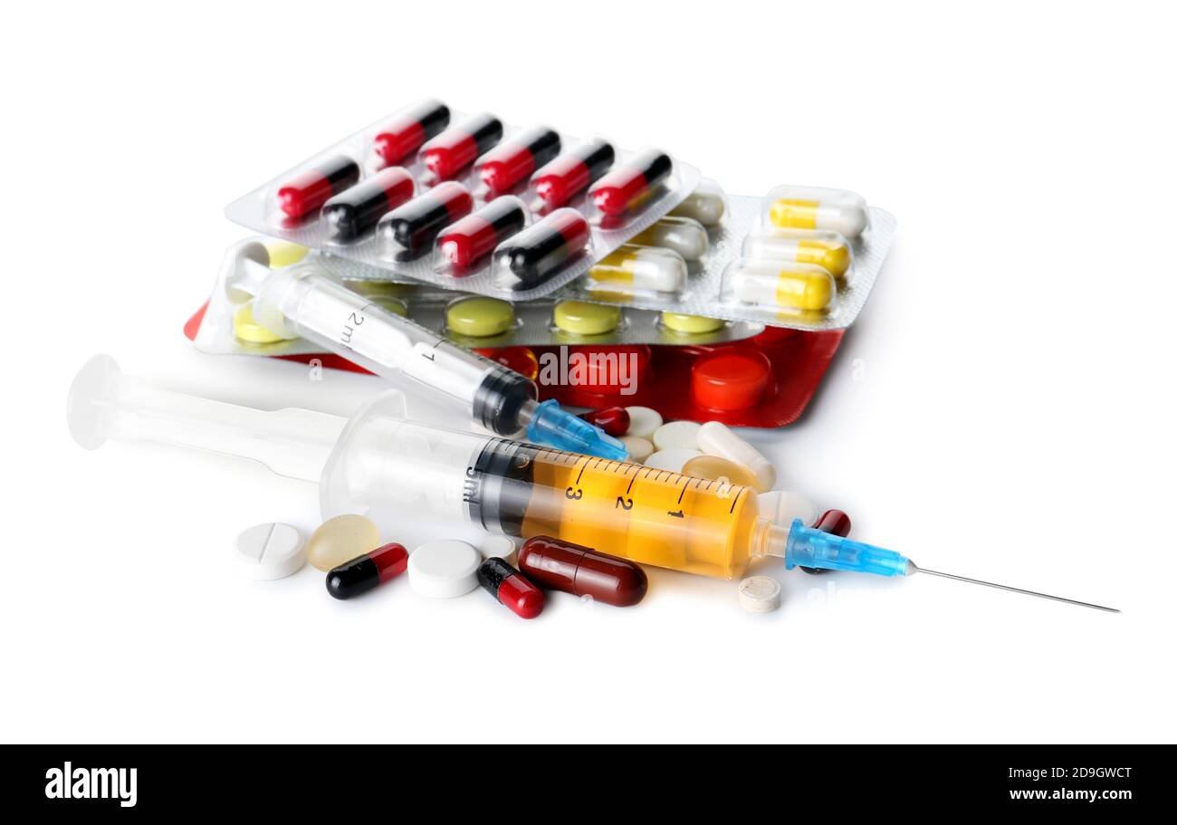 Pills and syringes for injection on white background Stock Photo - Alamy