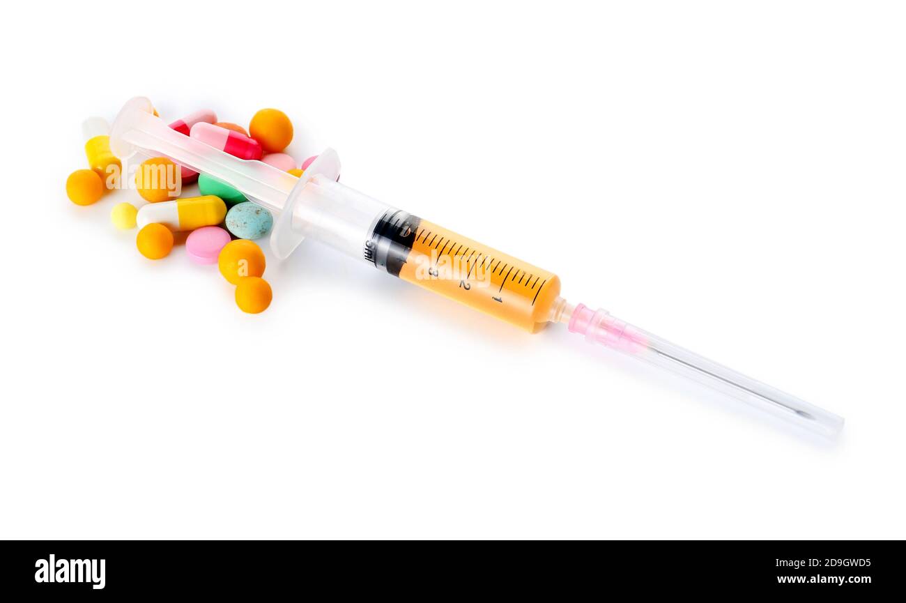 Pills and syringe for injection on white background Stock Photo - Alamy