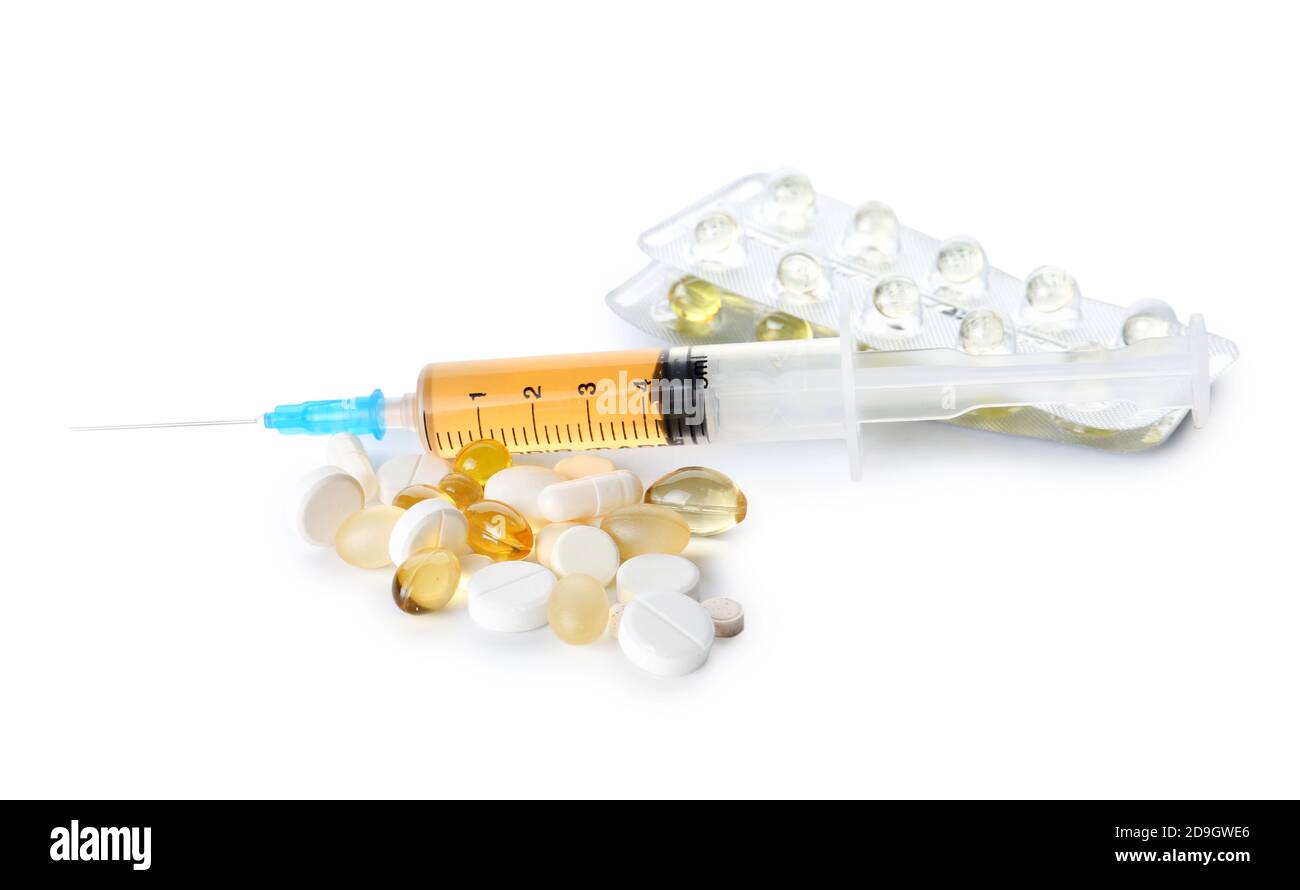 Pills and syringe for injection on white background Stock Photo - Alamy