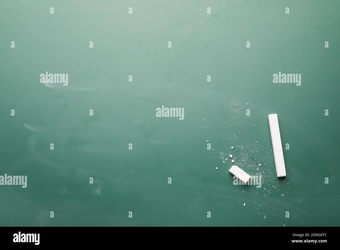 Pieces of chalk on blackboard, top view Stock Photo - Alamy