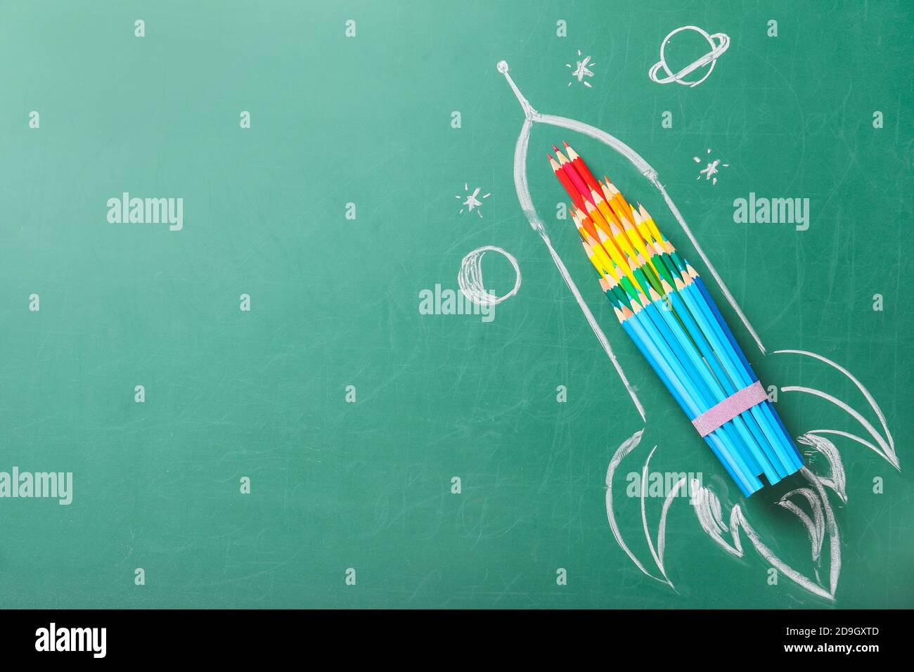 Creative composition with drawn space rocket and stationery on ...