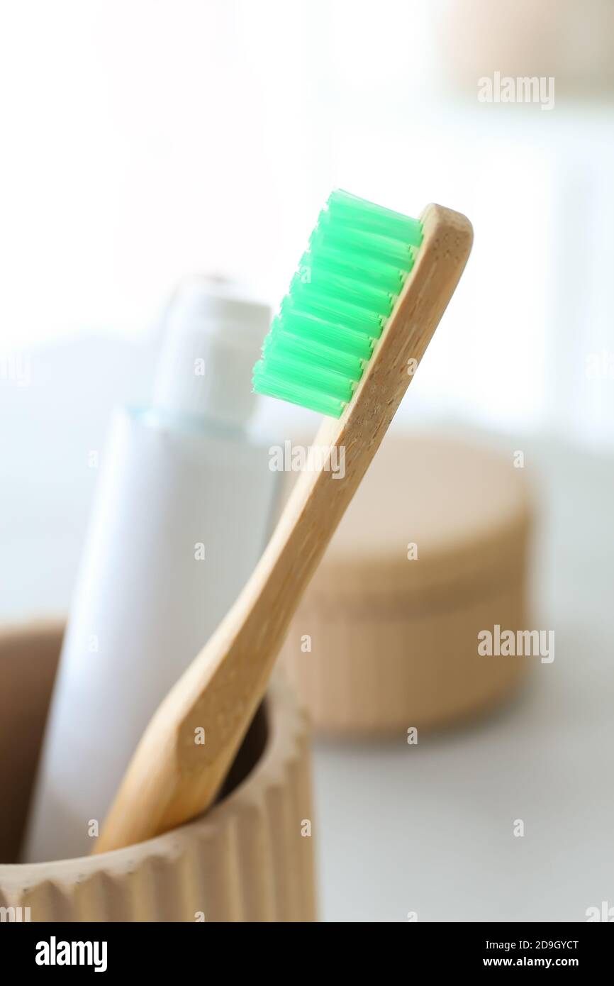 Toothbrush and paste in cup hi-res stock photography and images - Alamy