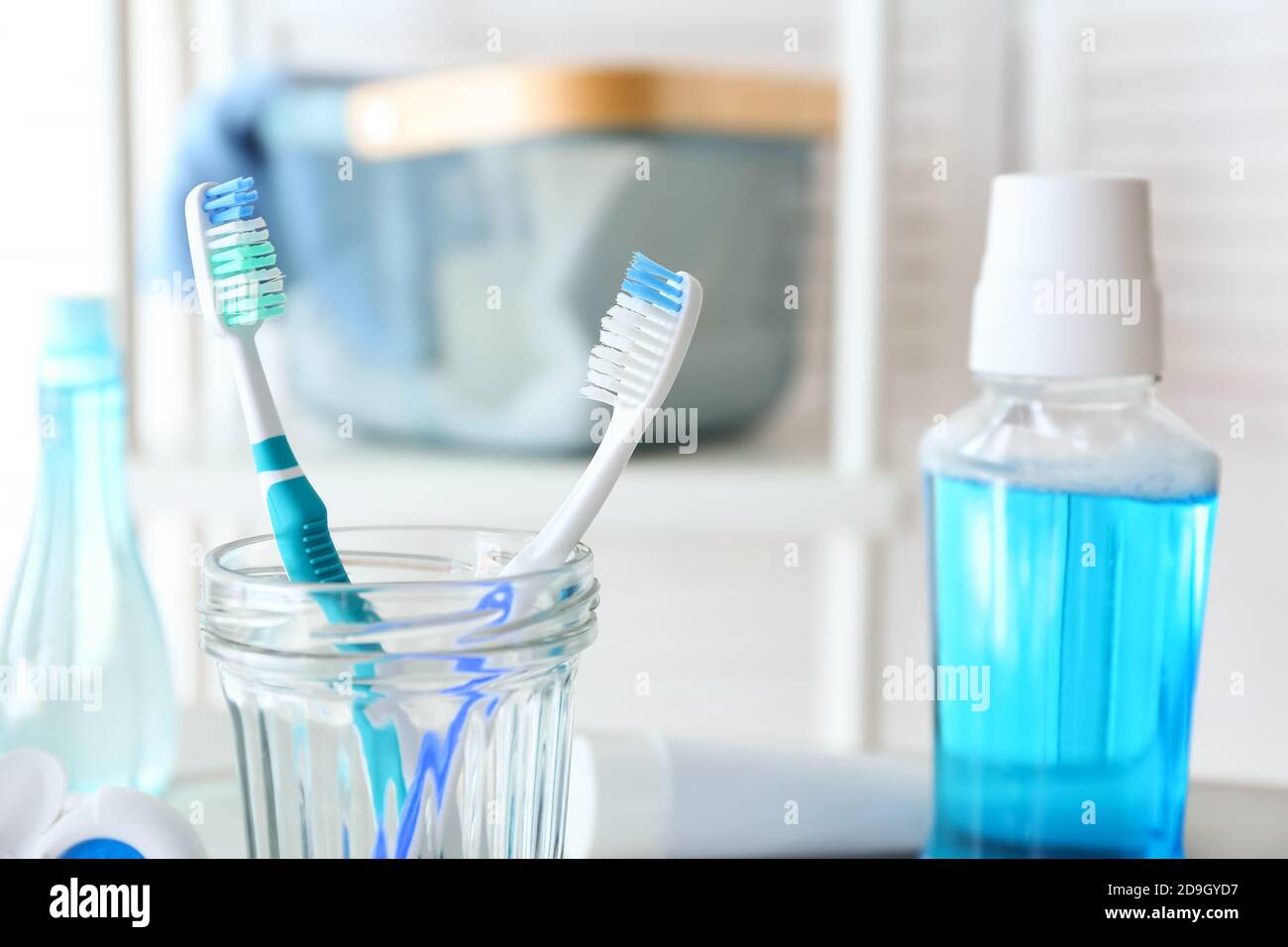 Set for oral hygiene in bathroom Stock Photo - Alamy