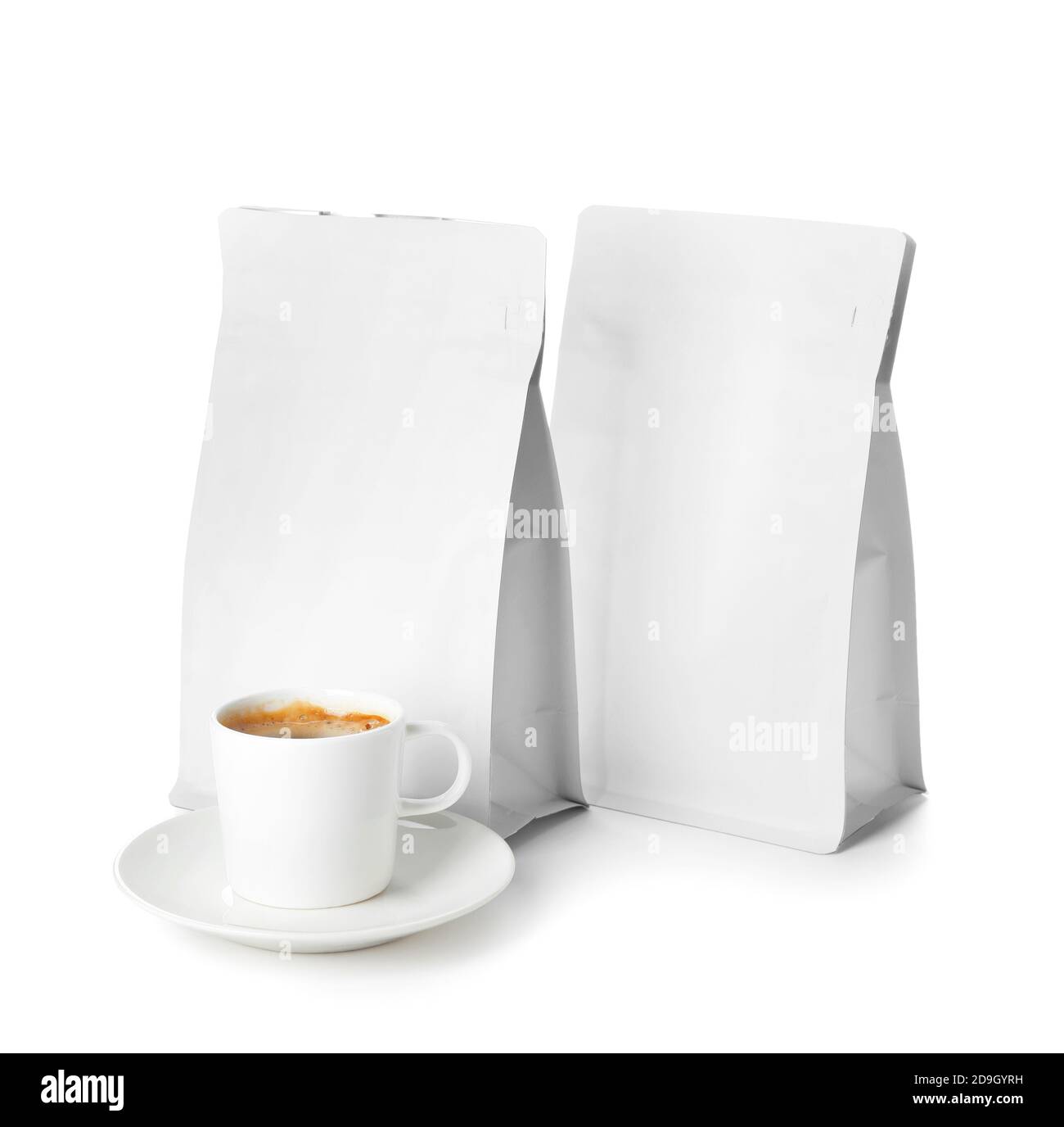 Blank coffee bags and cup on white background Stock Photo - Alamy