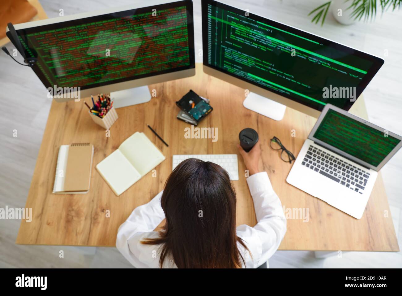 Female programmer working in office Stock Photo - Alamy