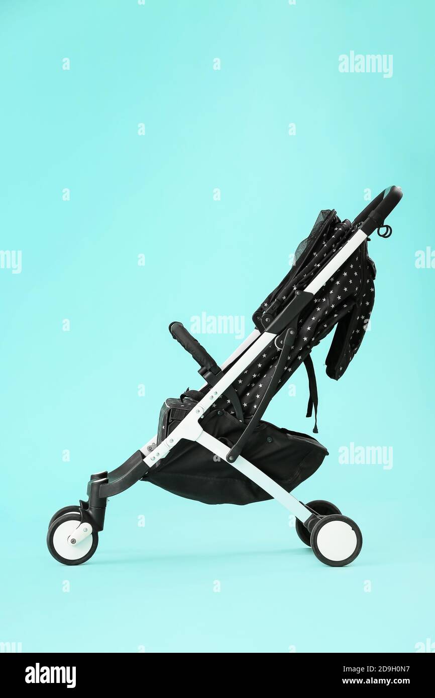 Modern baby stroller on color background Stock Photo - Alamy