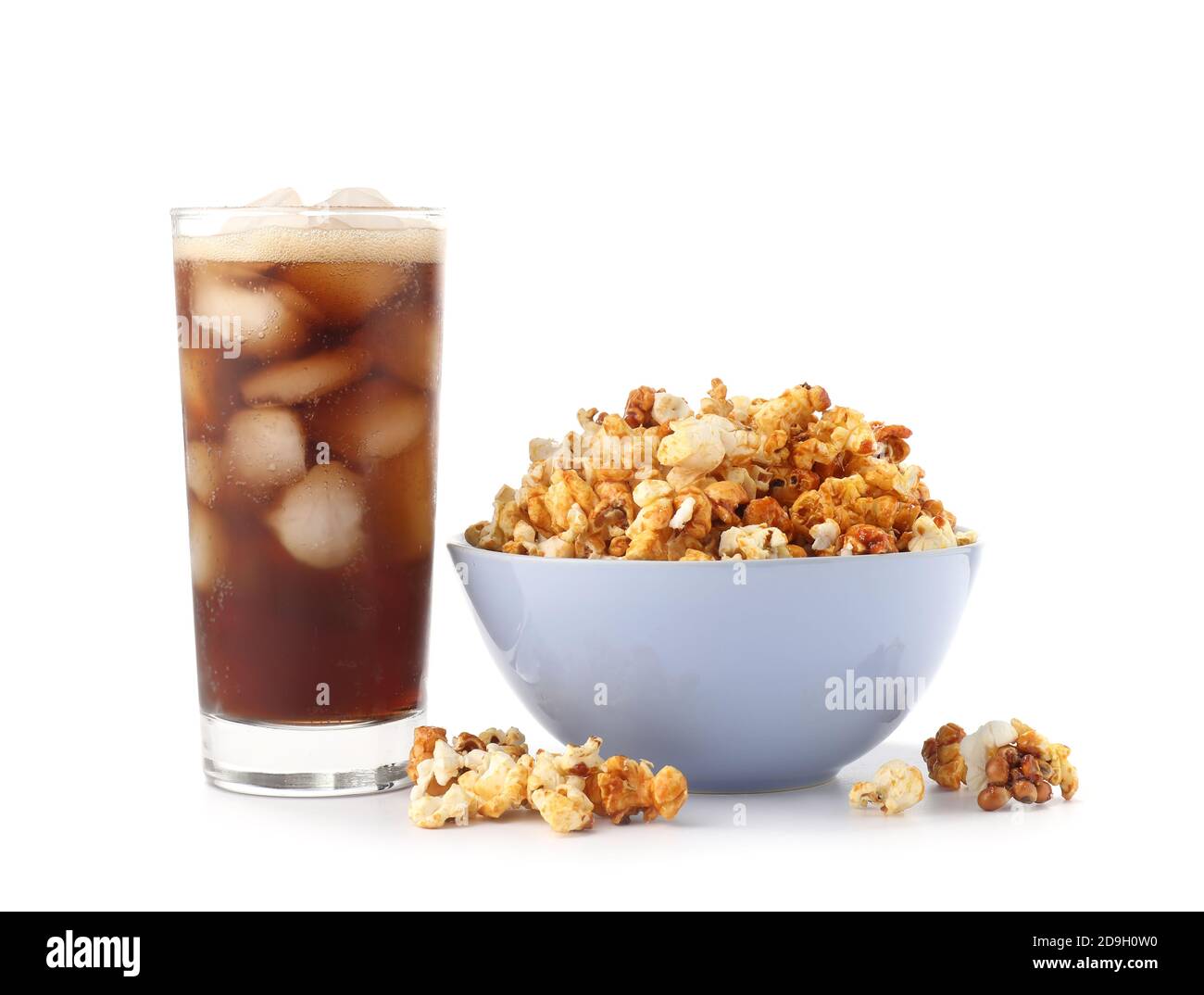 Tasty popcorn and cola on white background Stock Photo - Alamy
