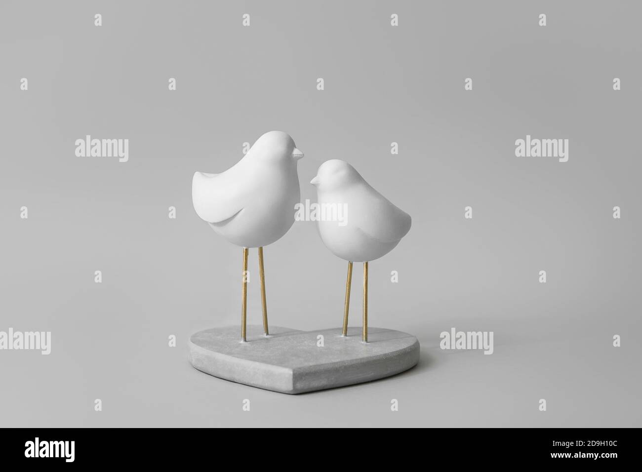Decorative figure of birds on grey background Stock Photo - Alamy