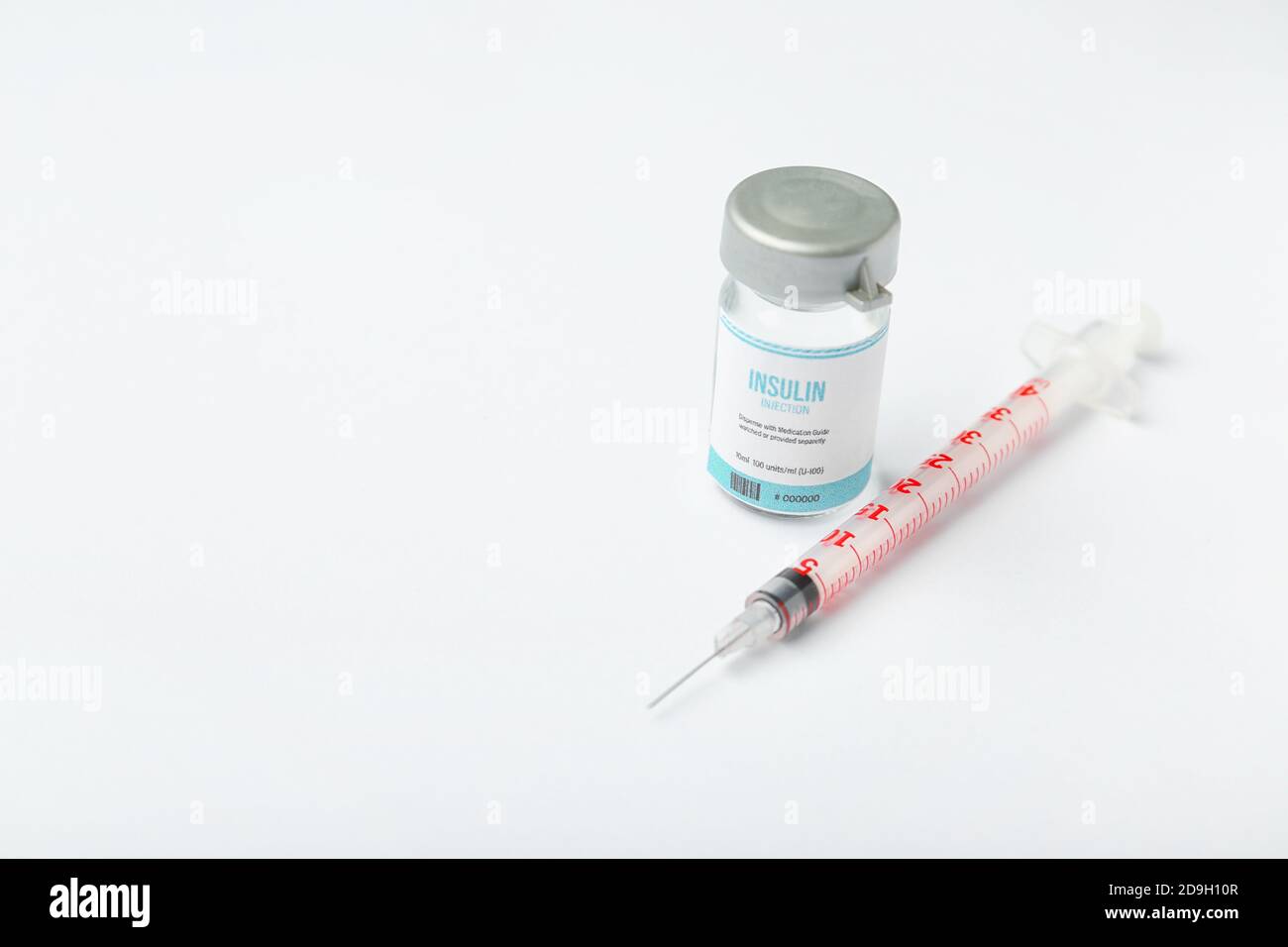 Bottle of insulin with syringe on white background. Diabetes concept ...